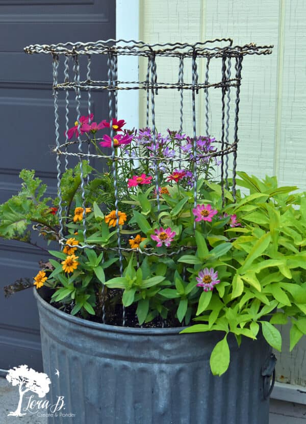 Repurposed Garbage Can Planter with Vintage Fencing - Lora Bloomquist ...