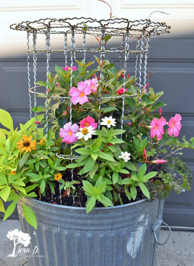 Repurposed Garbage Can Planter with Vintage Fencing - Lora Bloomquist ...