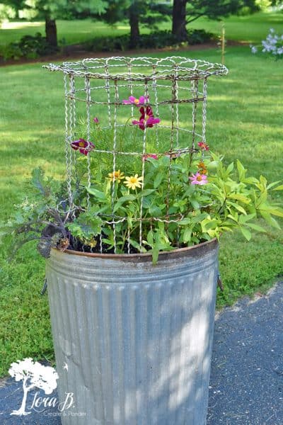 Repurposed Garbage Can Planter with Vintage Fencing - Lora Bloomquist ...