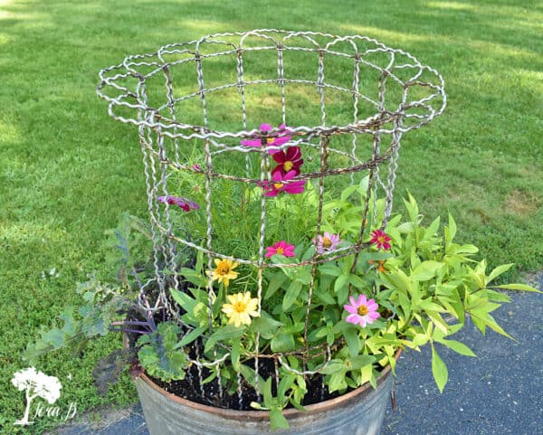 Repurposed Garbage Can Planter with Vintage Fencing - Lora Bloomquist ...